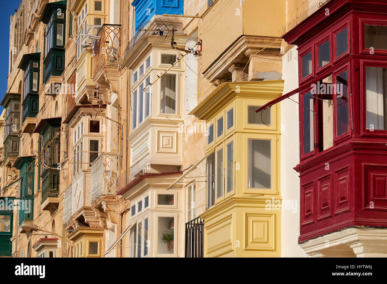 A traditional Maltese style different colored balconies in Valletta ...