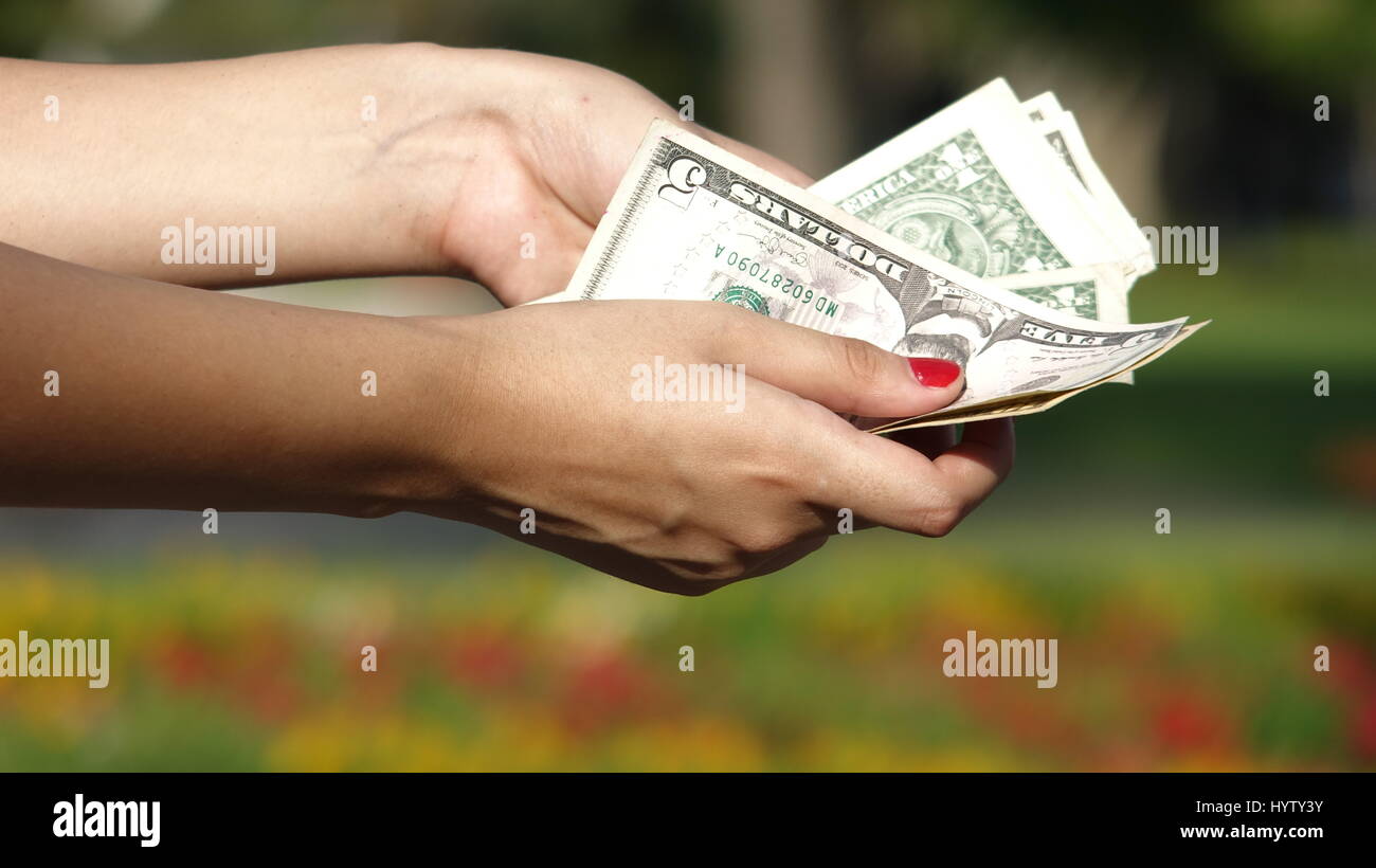 Women counting money hi-res stock photography and images - Alamy