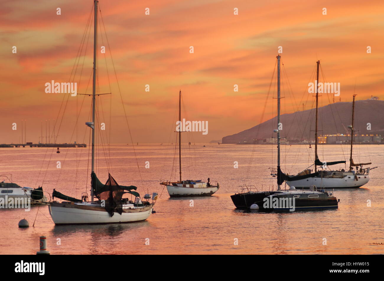 Anchored Sailboats at Sunset Stock Photo - Alamy