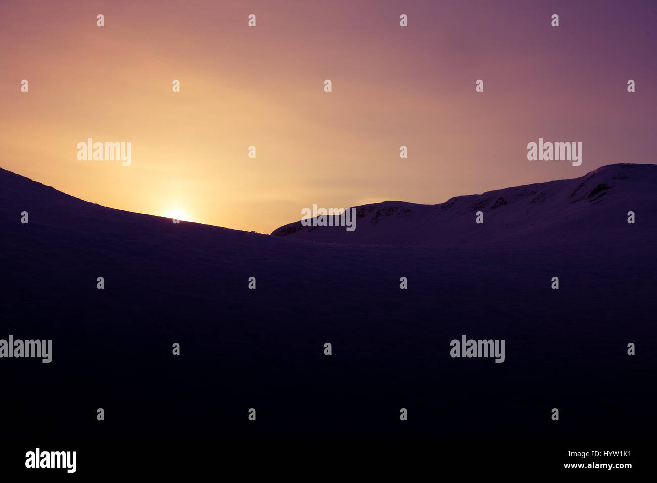 A beautiful, artistic, colorful sunset in Norway above mountains Stock ...
