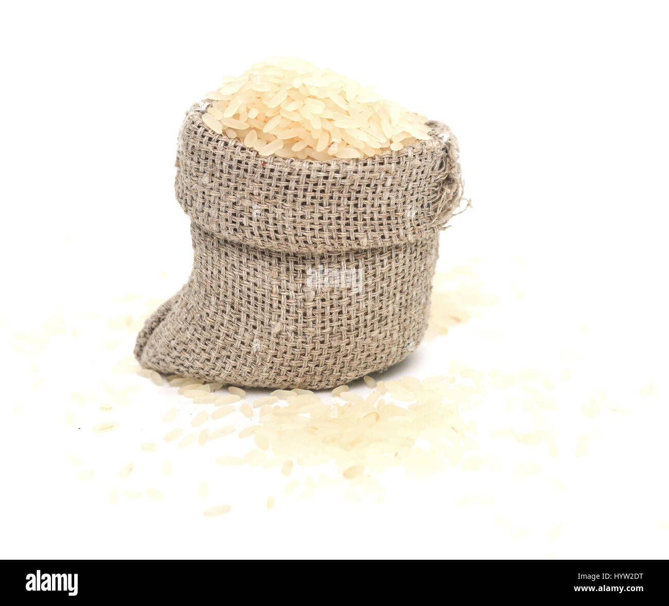 raw rice in sack isolated on white background Stock Photo - Alamy