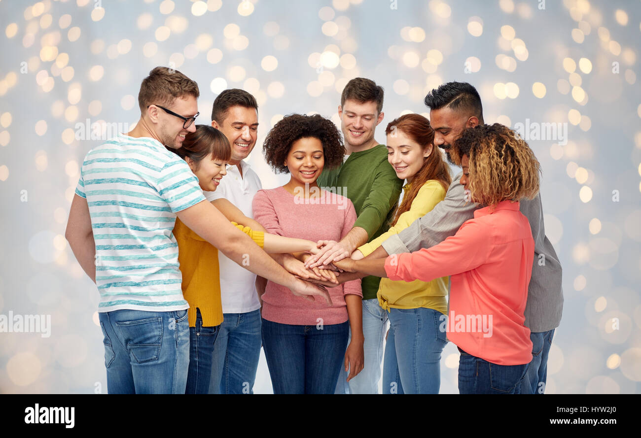 international group of happy people holding hands Stock Photo - Alamy