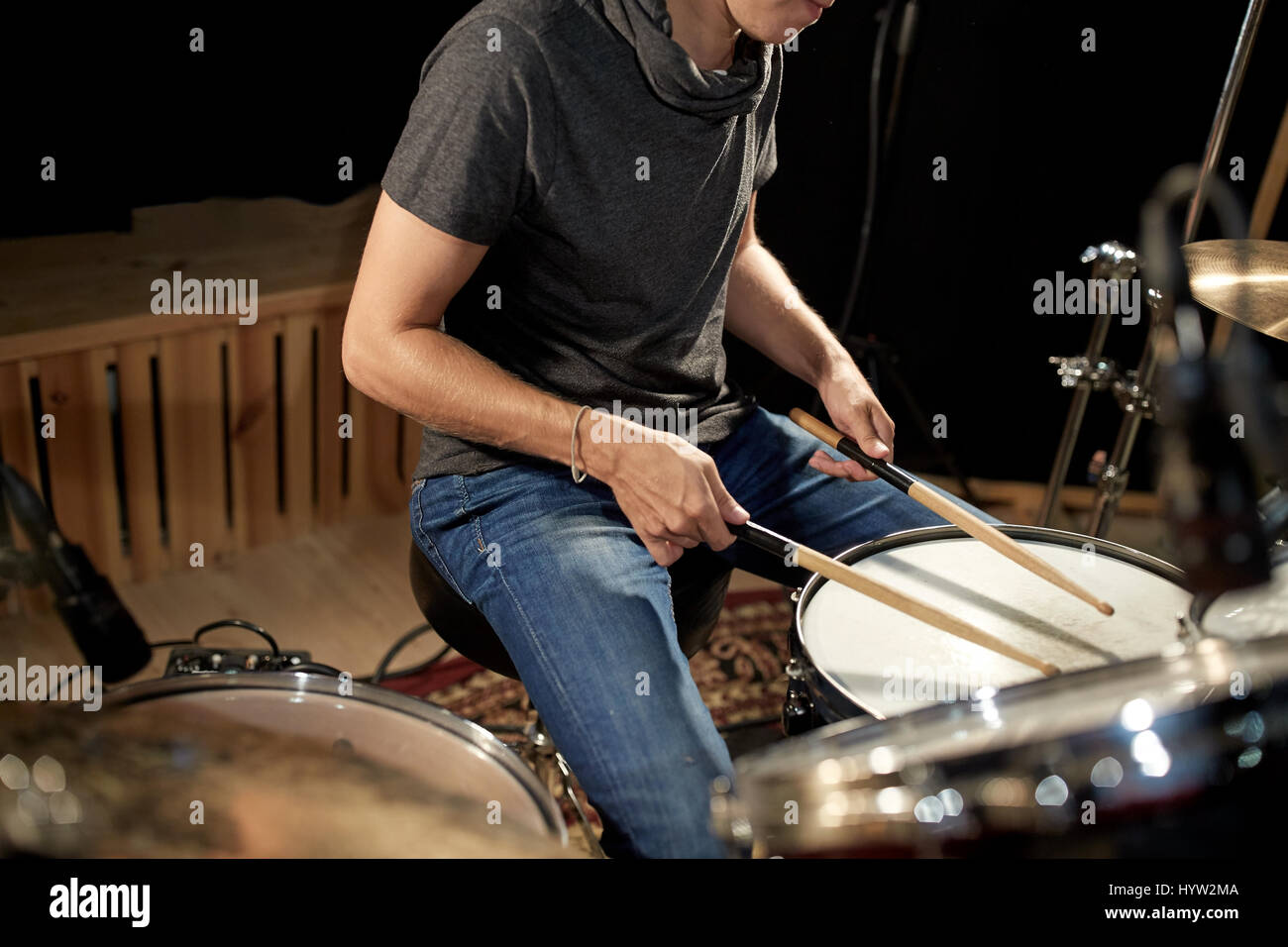 male musician playing drums and cymbals at concert Stock Photo - Alamy