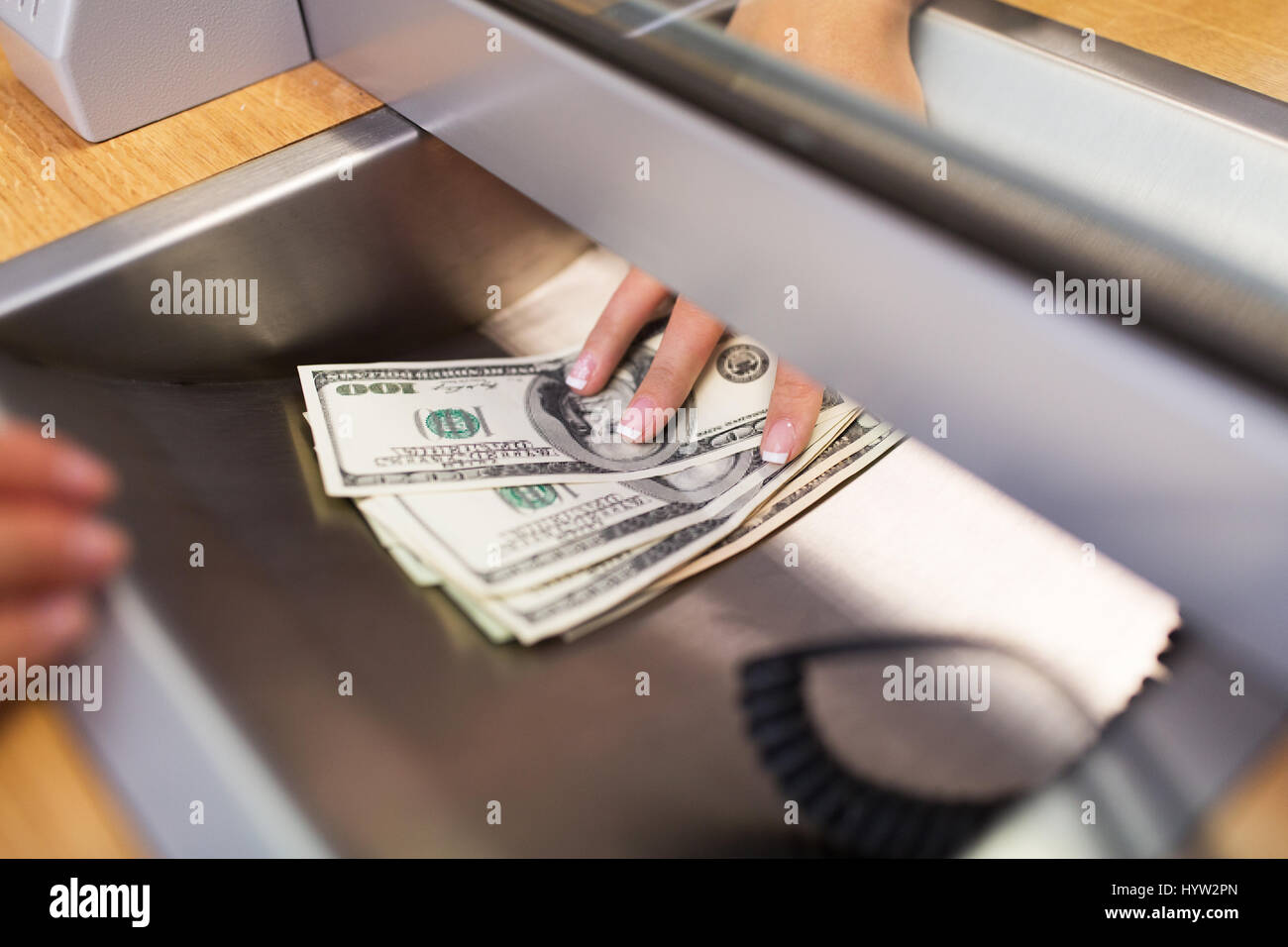 clerk giving cash money to customer at bank office Stock Photo - Alamy