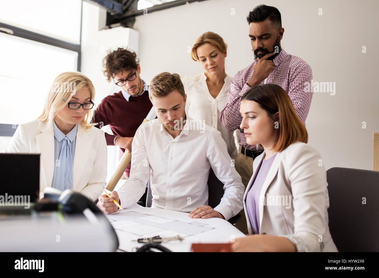 business team discussing house project at office Stock Photo - Alamy