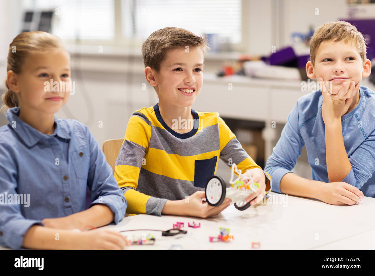 happy children building robots at robotics school Stock Photo - Alamy