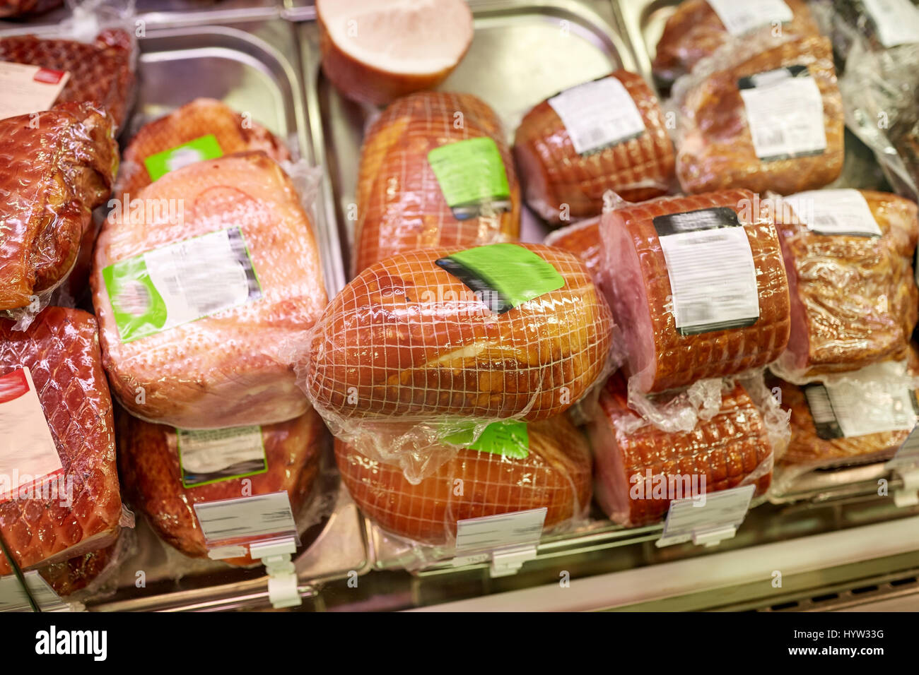 ham at grocery store stall Stock Photo - Alamy
