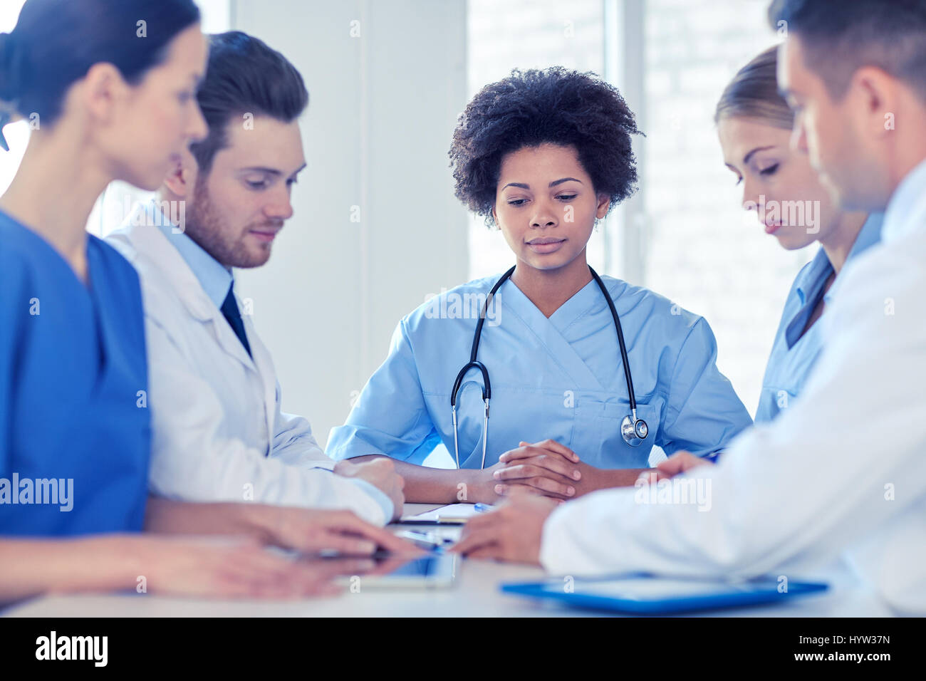 Doctors conference table nurses serious hi-res stock photography and ...