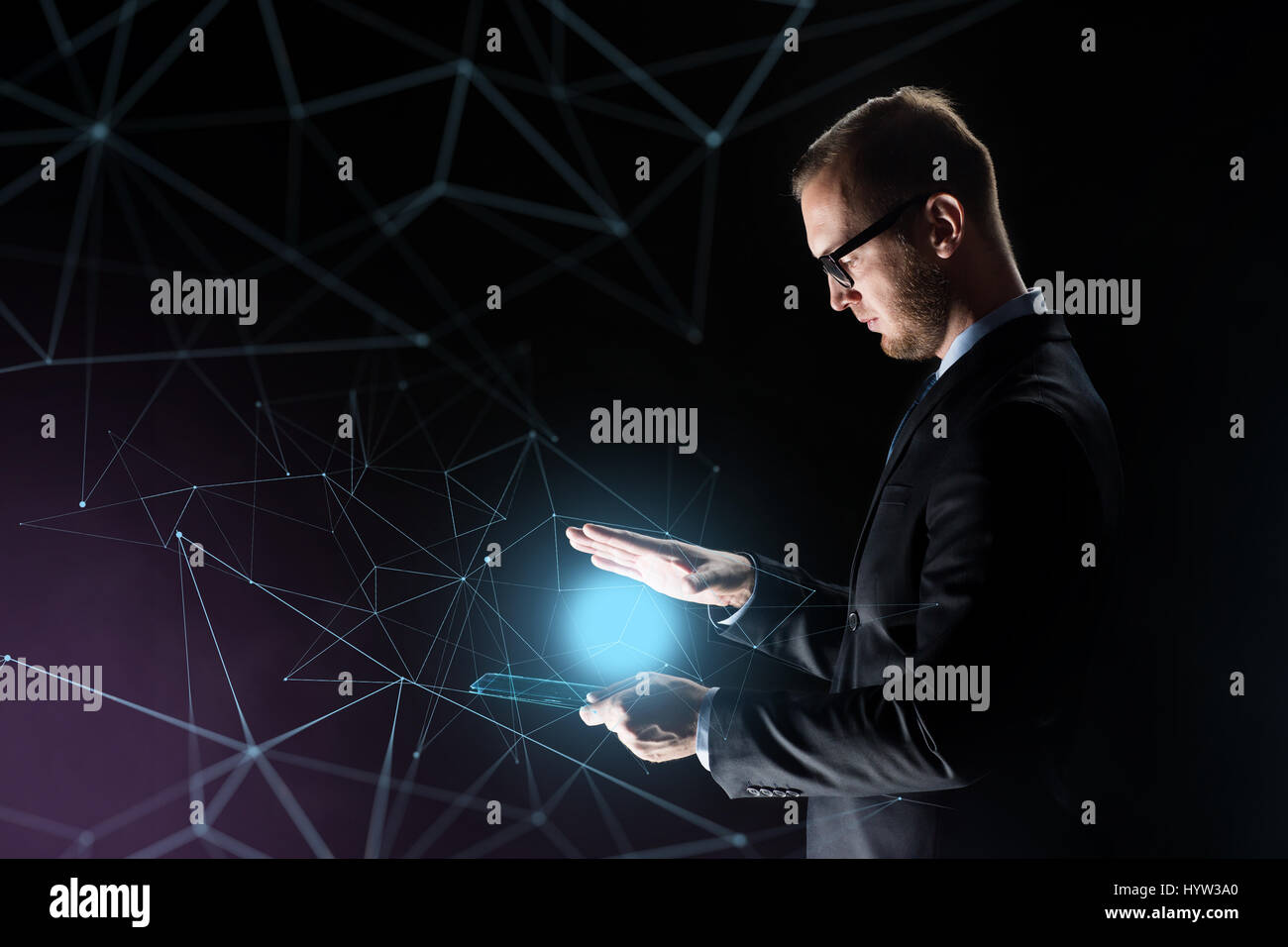 businessman with light above transparent tablet pc Stock Photo - Alamy