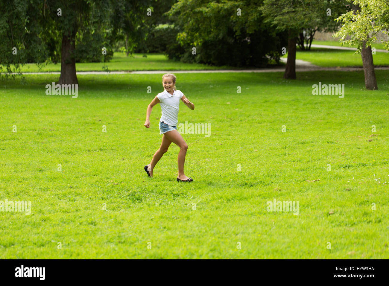 happy girl running and playing at summer outdoors Stock Photo - Alamy