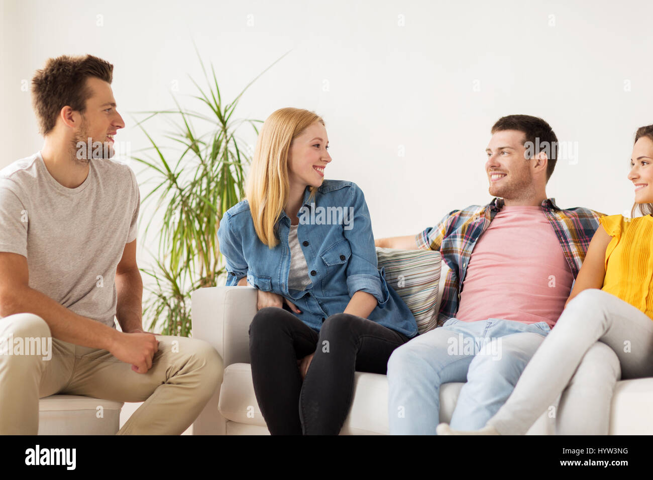 group of happy friends talking at home Stock Photo - Alamy
