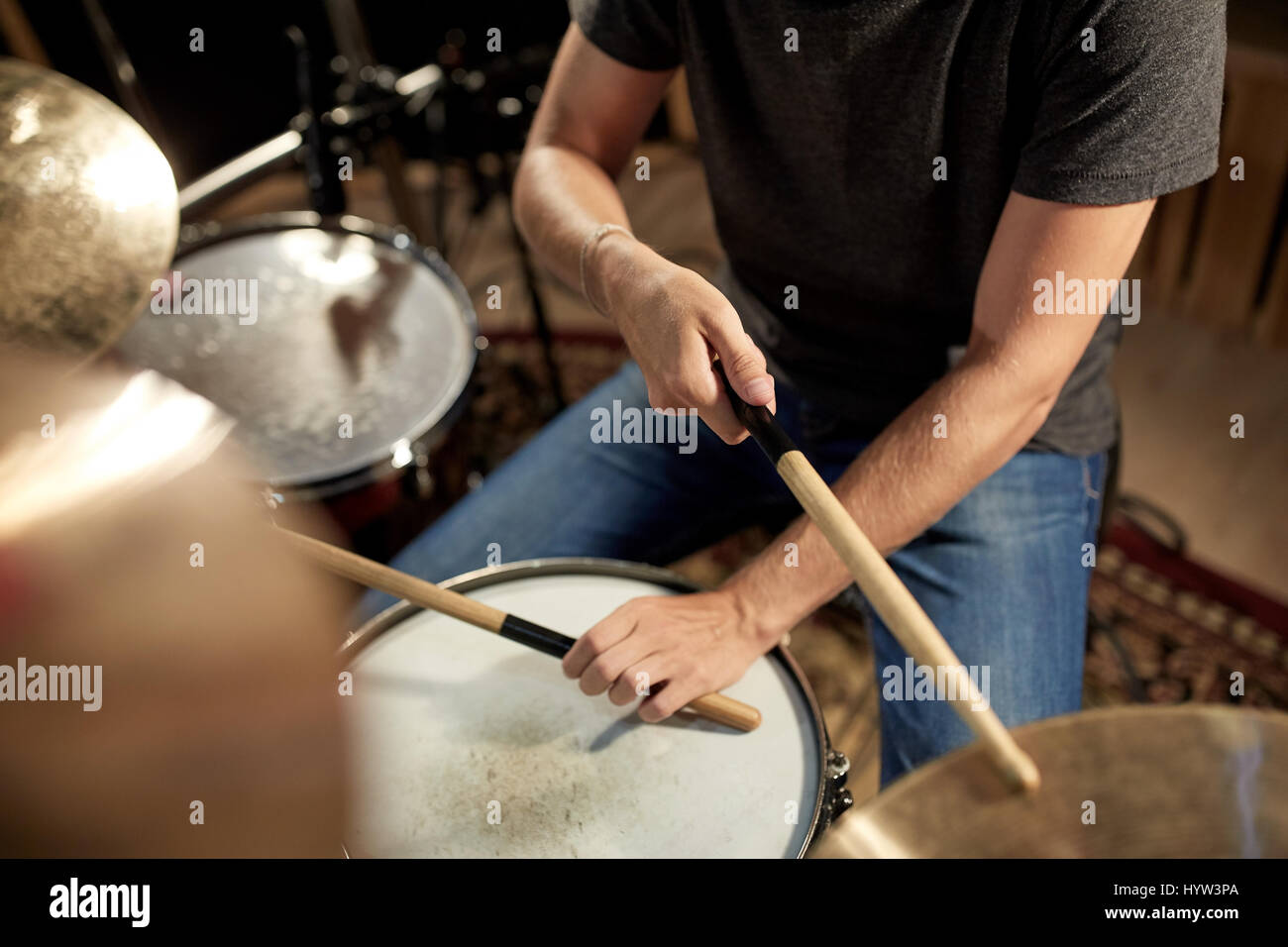 male musician playing drums and cymbals at concert Stock Photo - Alamy
