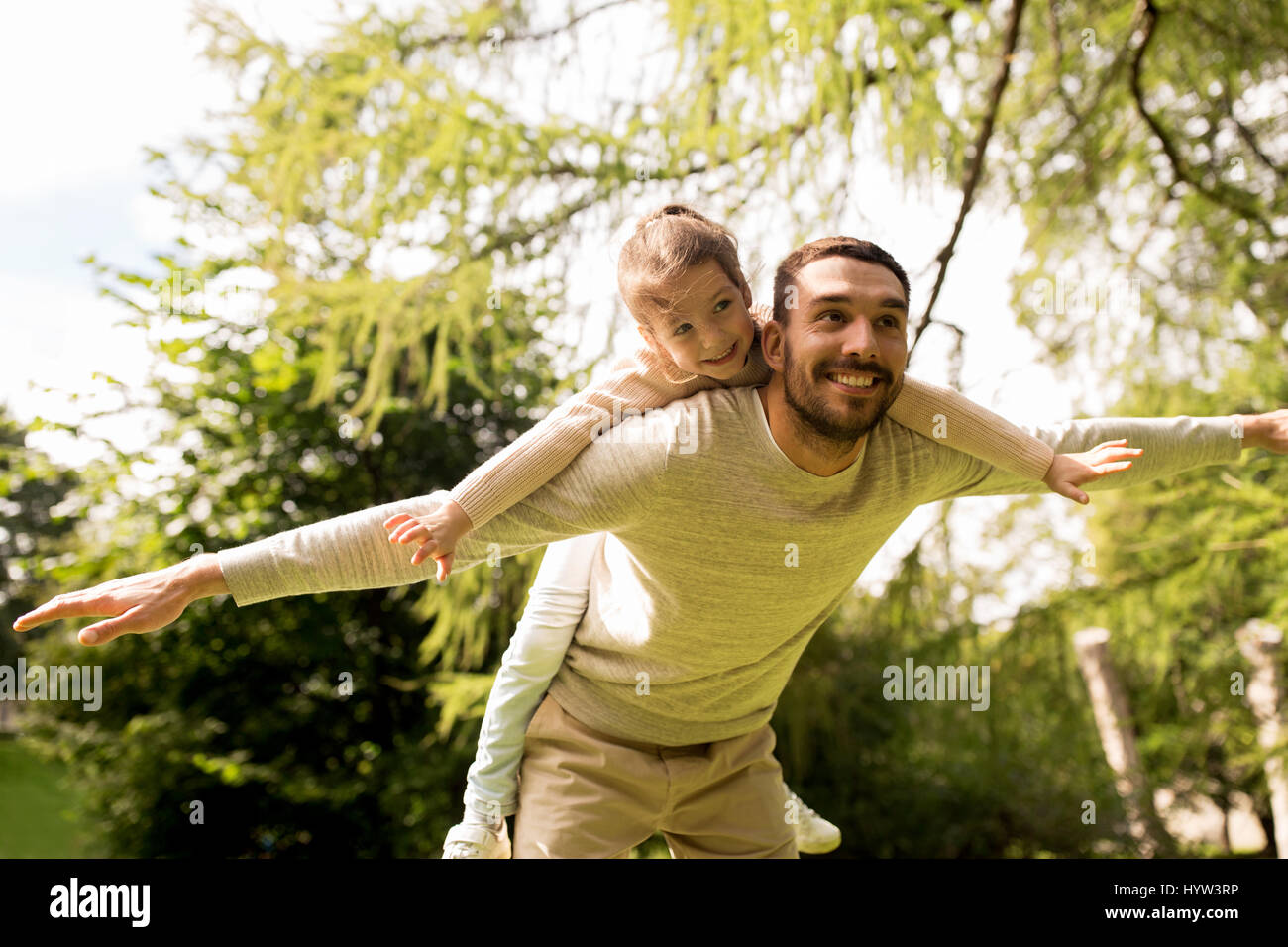 happy family having fun in summer park Stock Photo - Alamy