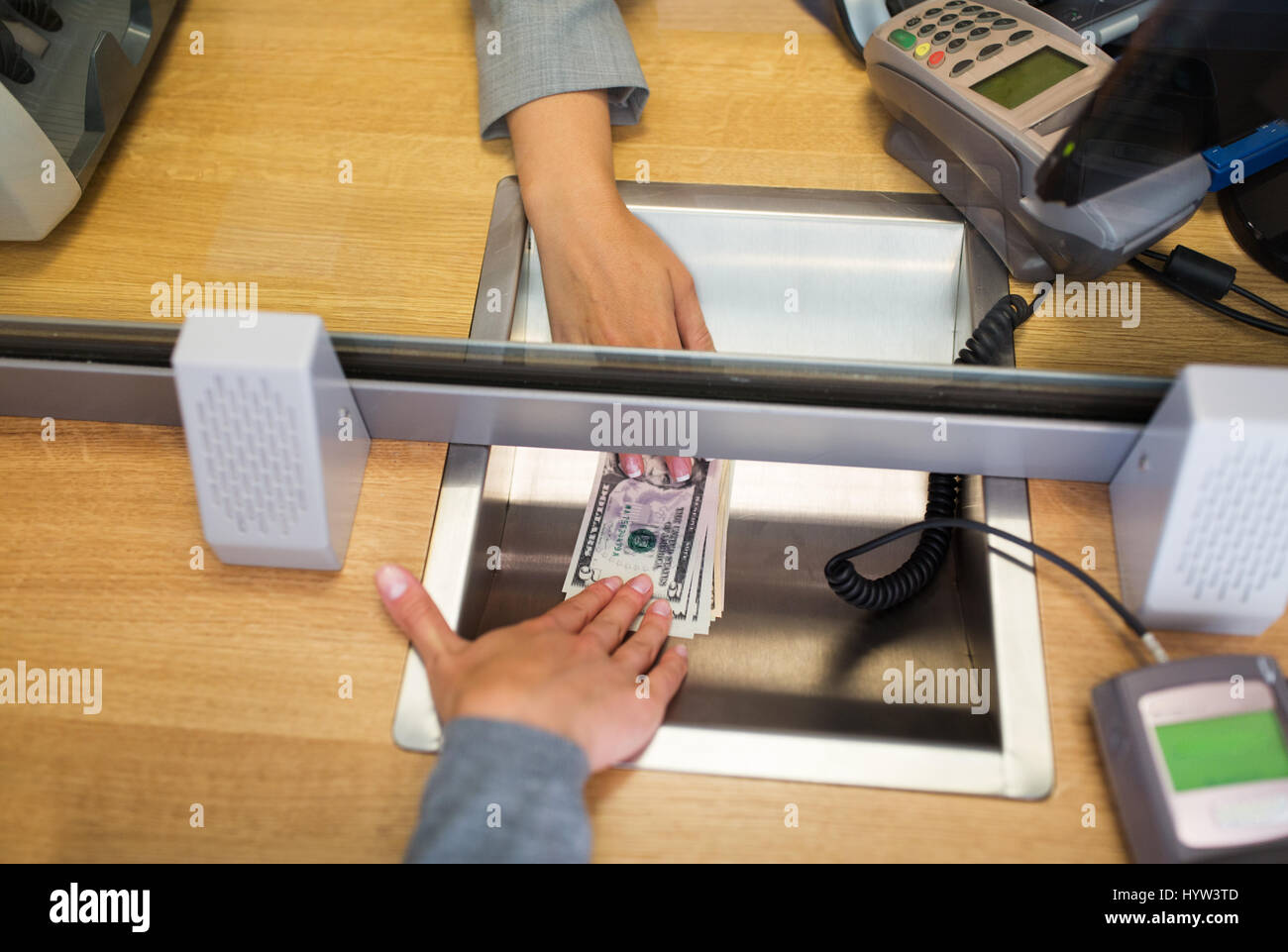 Female cashier giving money hi-res stock photography and images - Alamy