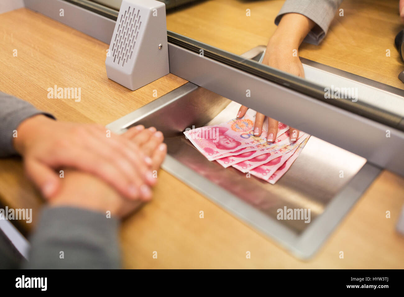 clerk giving cash money to customer at bank office Stock Photo - Alamy