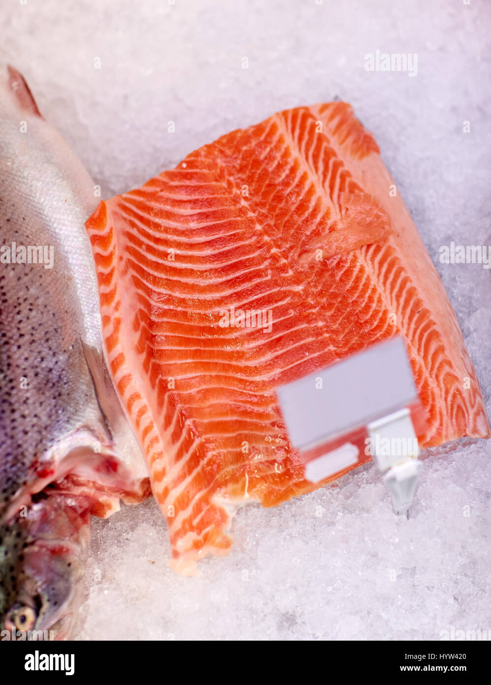 salmon fish fillet on ice at grocery Stock Photo - Alamy