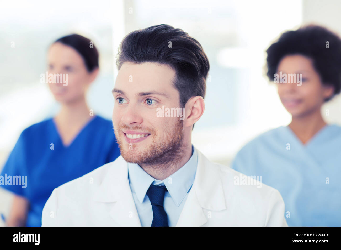 happy doctor over group of medics at hospital Stock Photo - Alamy