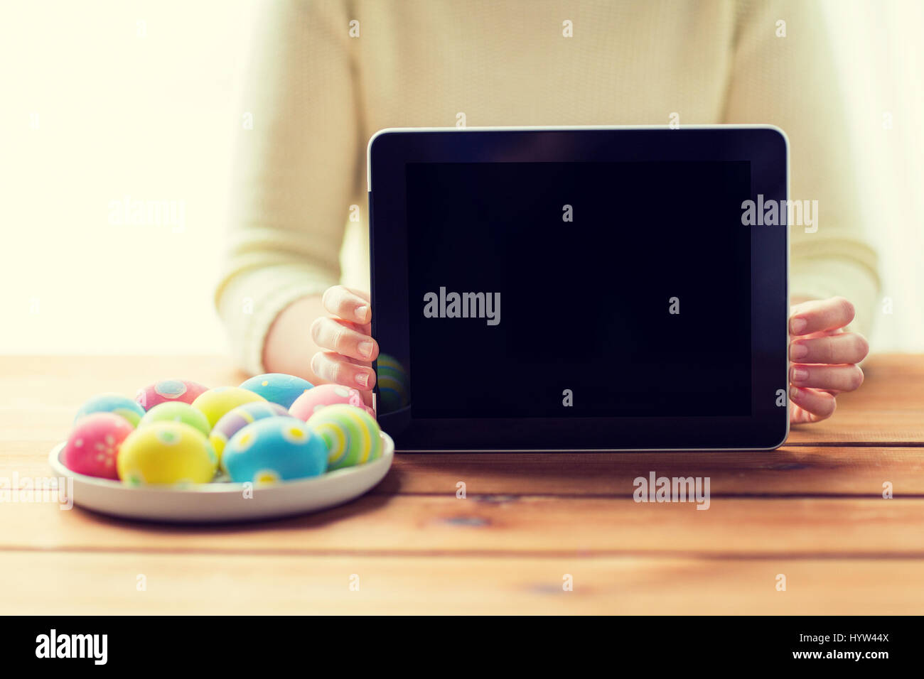 close up of woman with tablet pc and easter eggs Stock Photo - Alamy
