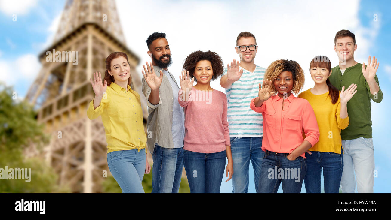 international people waving hand over eiffel tower Stock Photo - Alamy