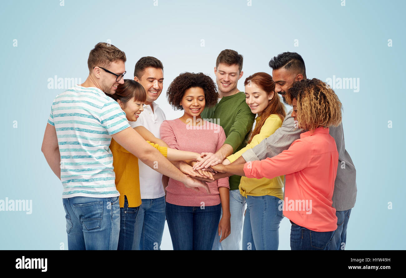 international group of happy people holding hands Stock Photo - Alamy