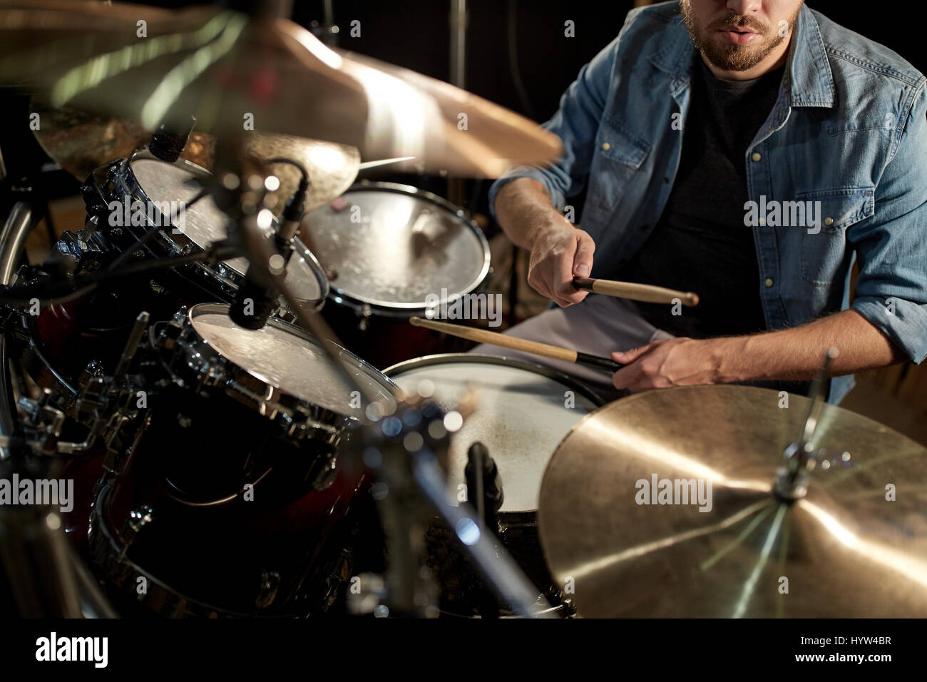 male musician playing drums and cymbals at concert Stock Photo - Alamy