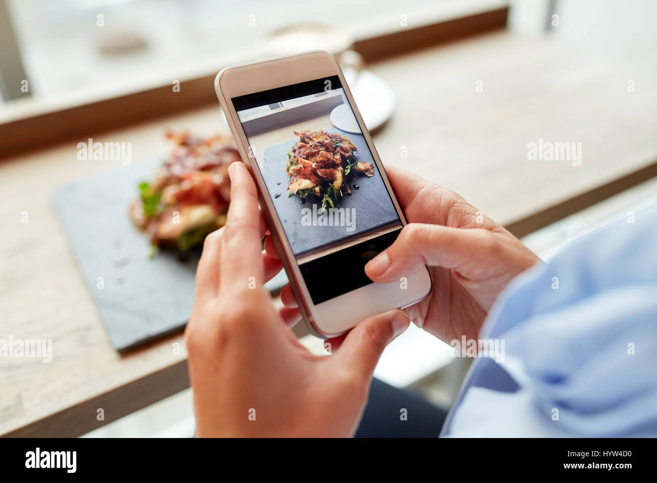 hands with smartphone photographing food Stock Photo - Alamy