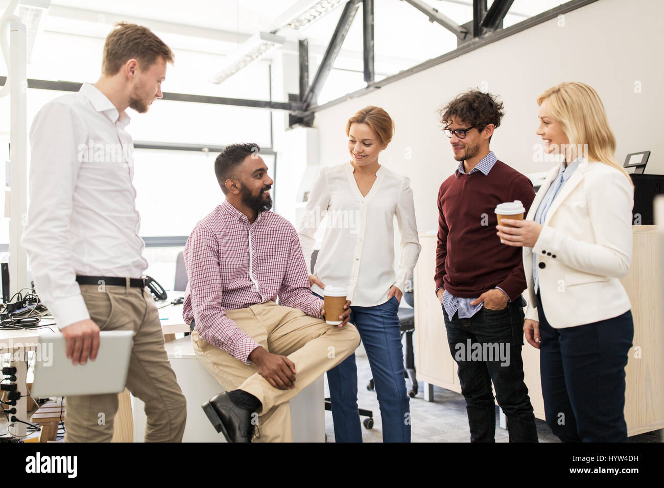 happy business team drinking coffee at office Stock Photo - Alamy