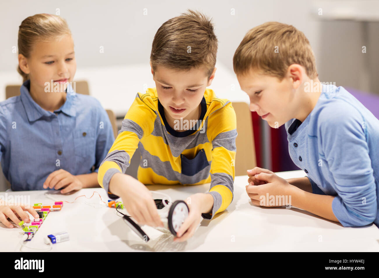 happy children building robots at robotics school Stock Photo - Alamy