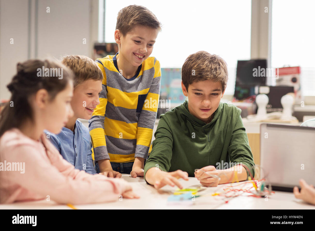 happy children building robots at robotics school Stock Photo - Alamy