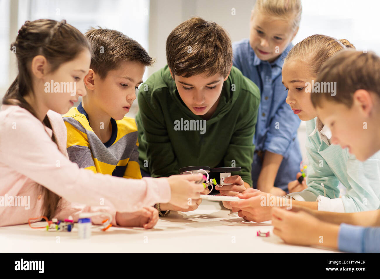 happy children building robots at robotics school Stock Photo - Alamy
