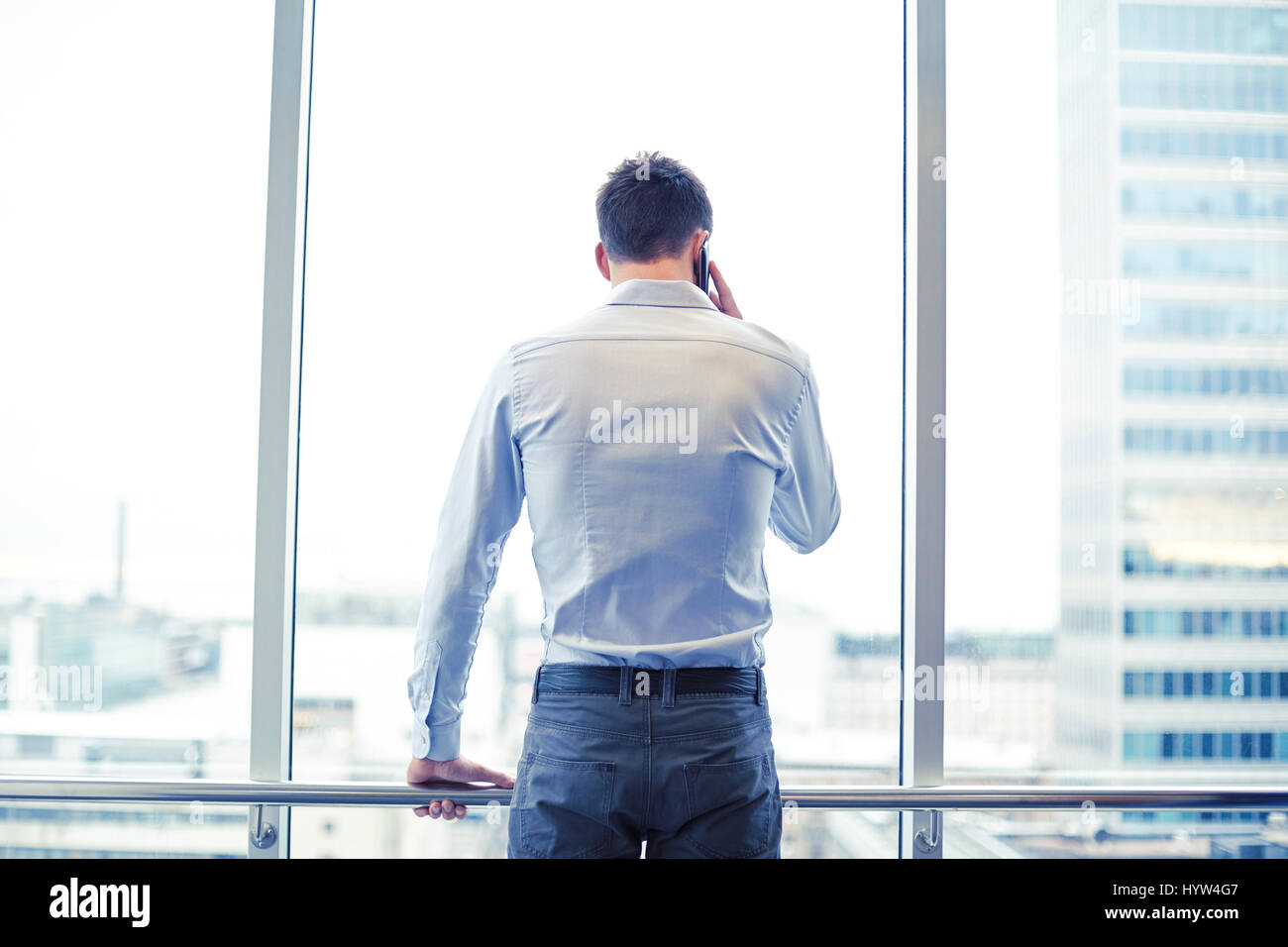 Young businessman taking call hi-res stock photography and images - Alamy