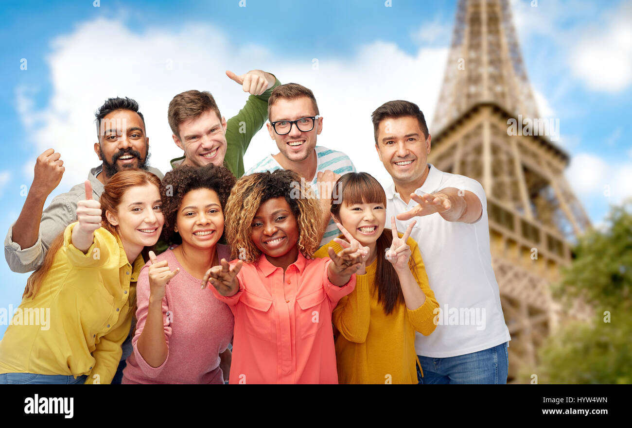international group of people over eiffel tower Stock Photo - Alamy