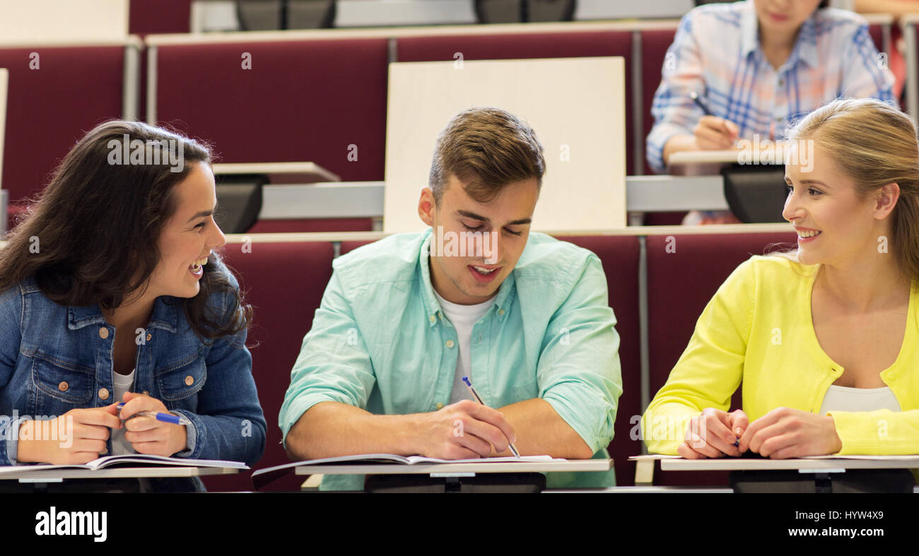 group of students with notebooks in lecture hall Stock Photo - Alamy
