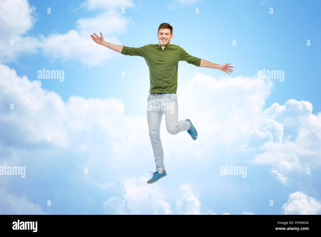 smiling young man jumping in air Stock Photo - Alamy