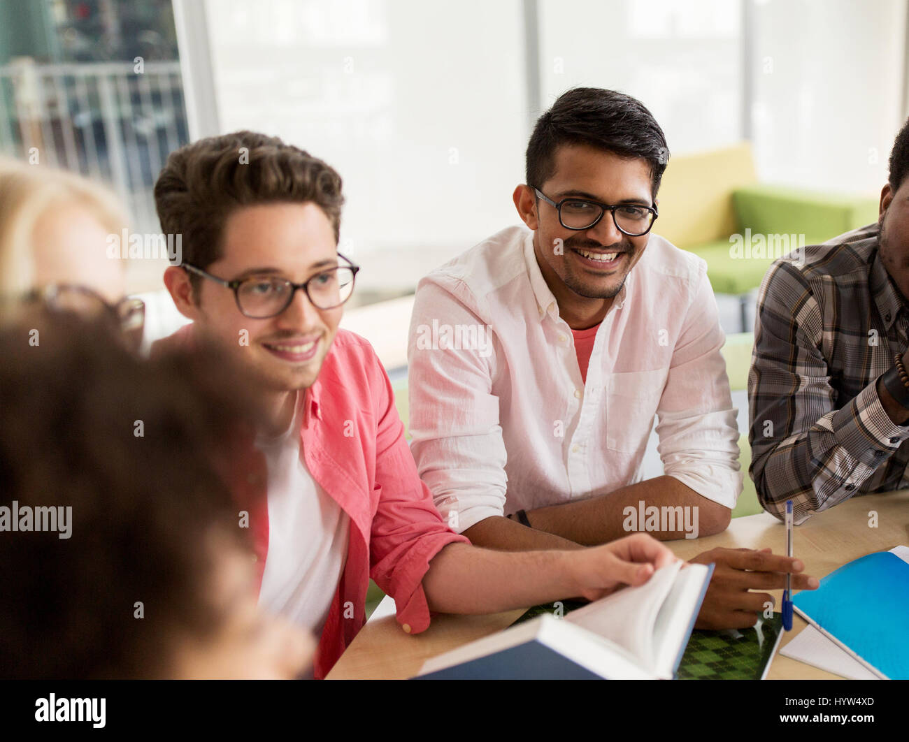 group of high school students sitting at table Stock Photo - Alamy