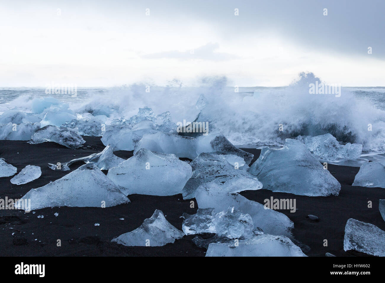 waves crashing over glacial ice, Iceland Stock Photo - Alamy