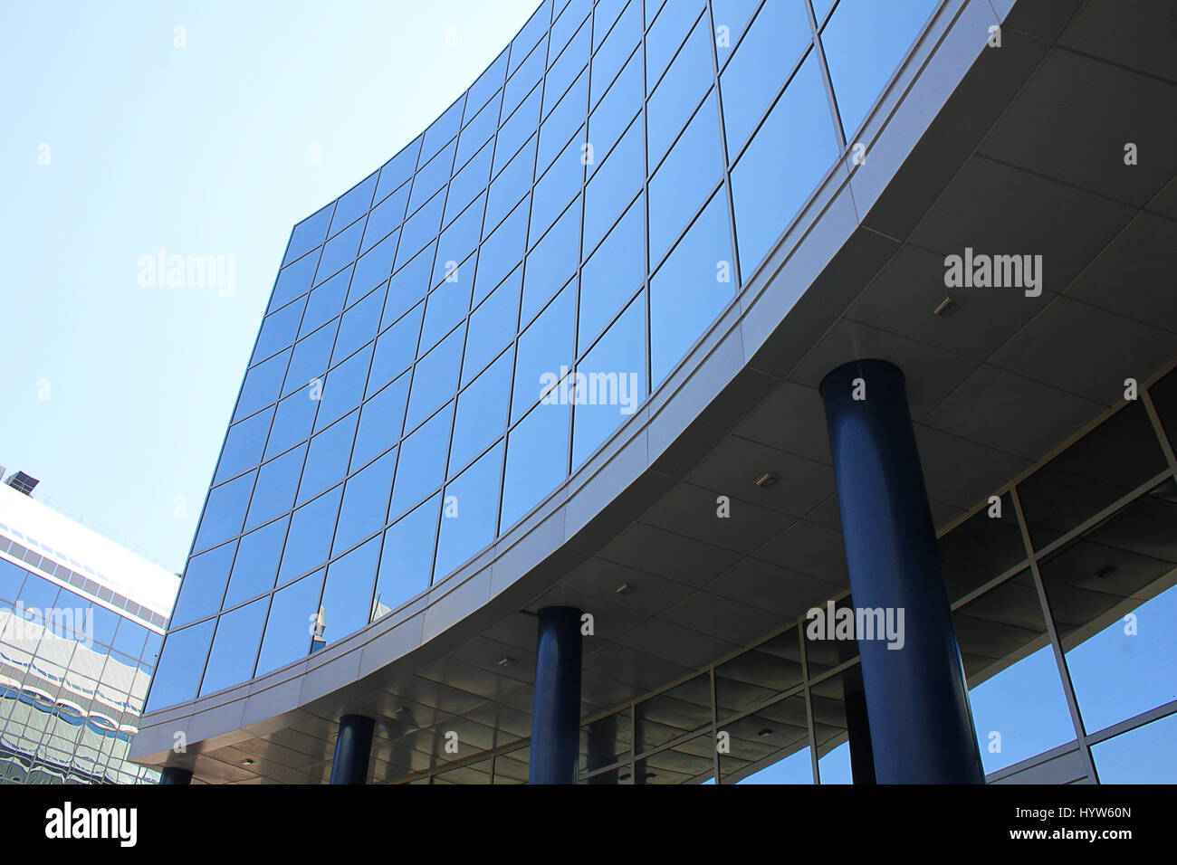 a glass building with columns Stock Photo - Alamy