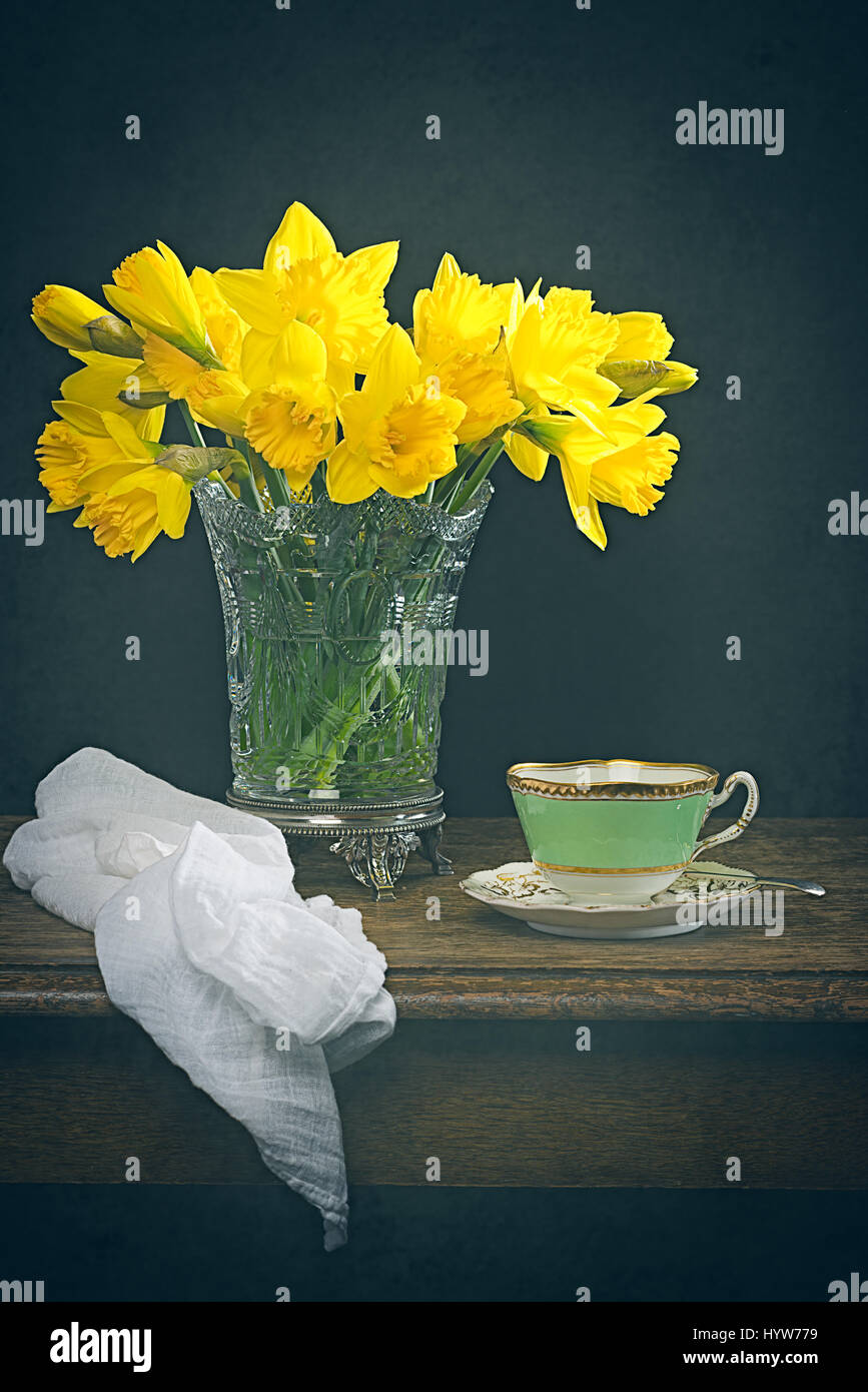 Spring daffodils still life with antique cup and saucer Stock Photo - Alamy