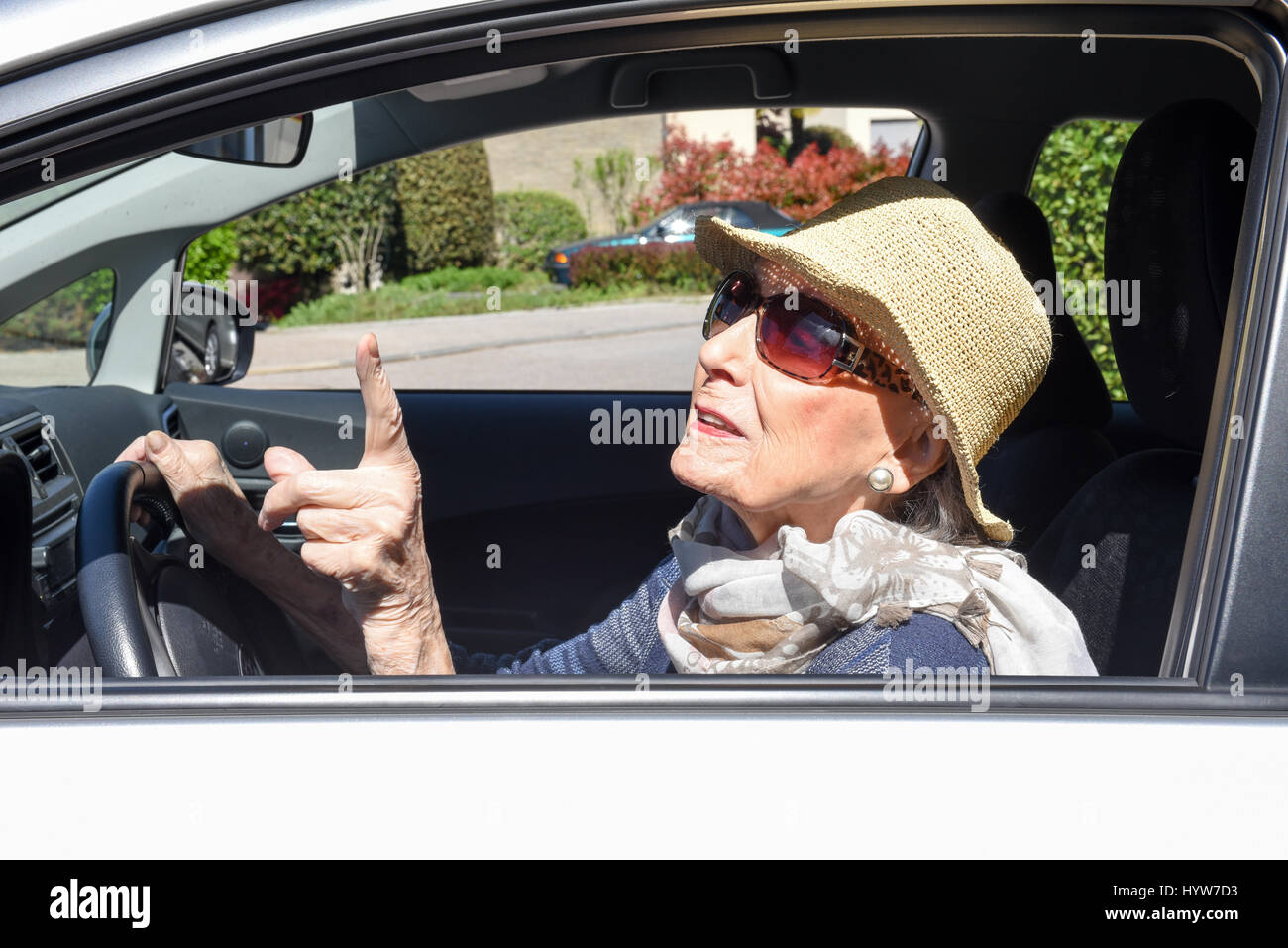 Lugano, Switzerland - 6 April 2017: old woman driving a car Stock Photo ...