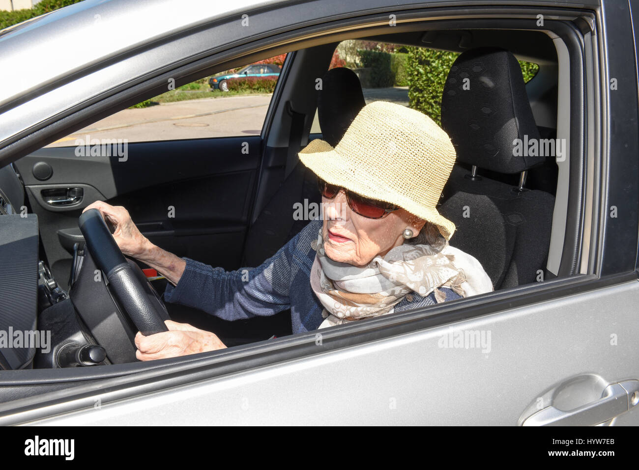 Lugano, Switzerland - 6 April 2017: old woman driving a car Stock Photo ...