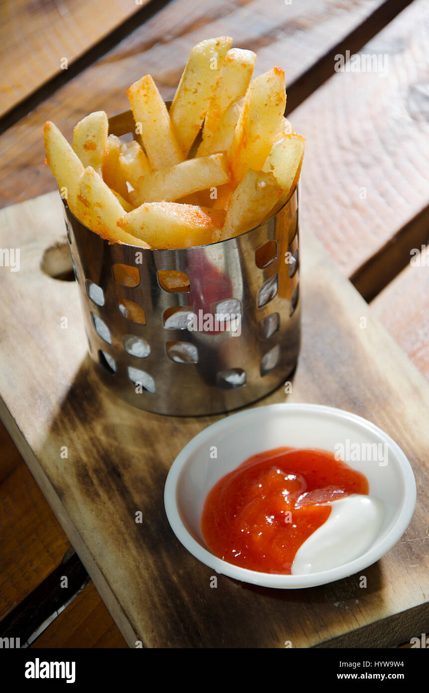 French fries with chili sauce Stock Photo - Alamy
