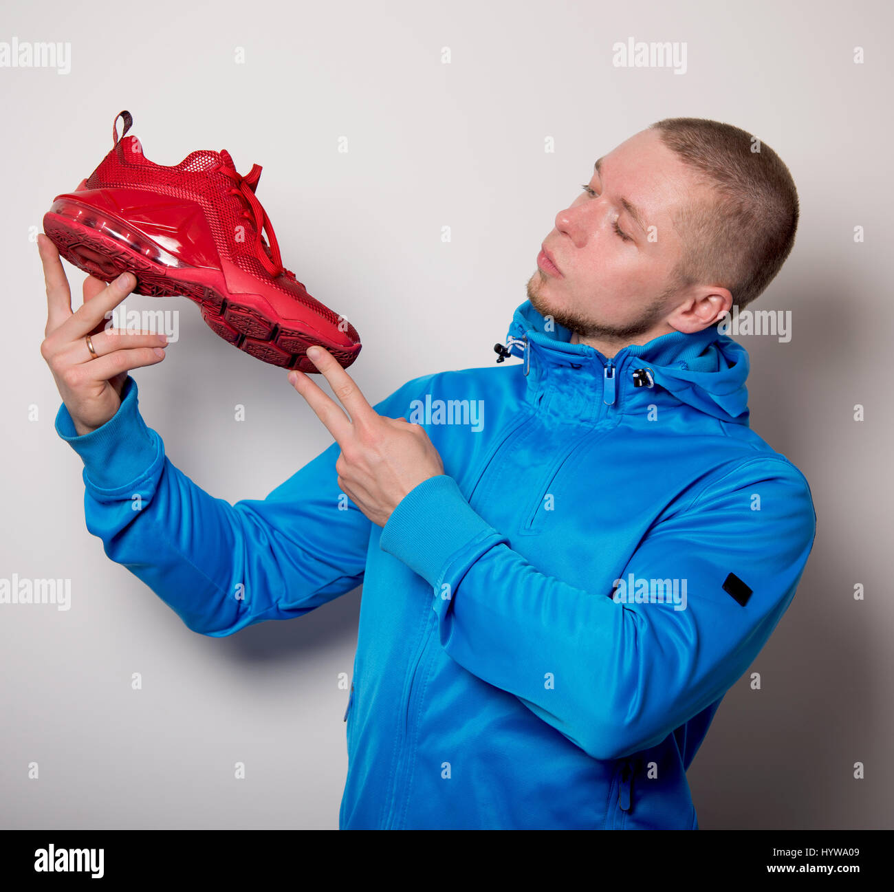 guy picks sneakers Stock Photo - Alamy
