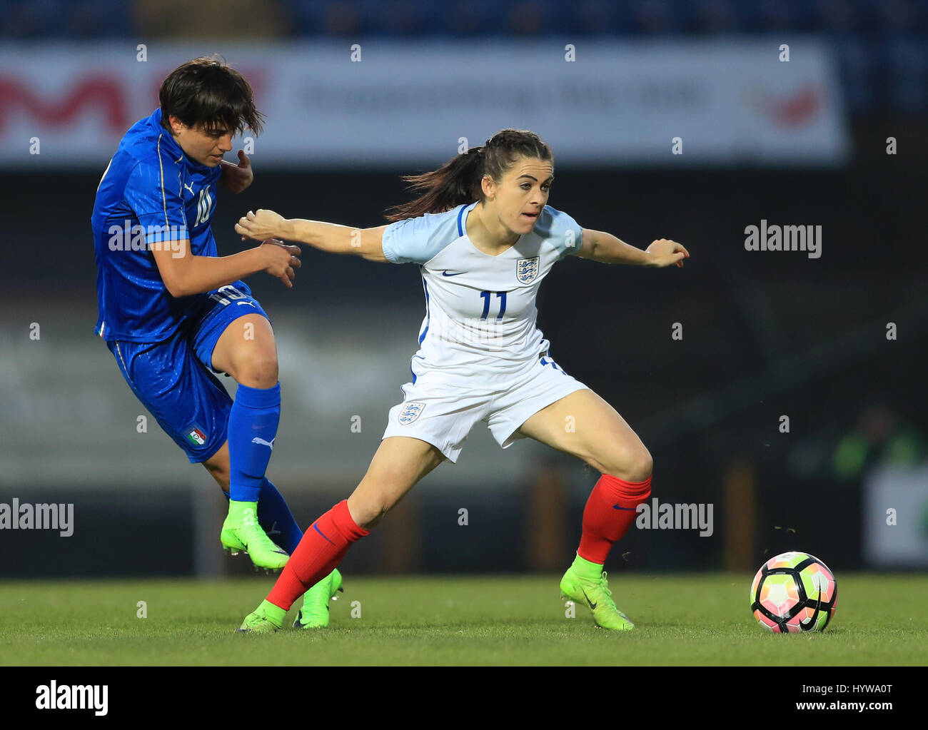Italy's Alice Parisi (left) and England's Karen Carney battle for the ...