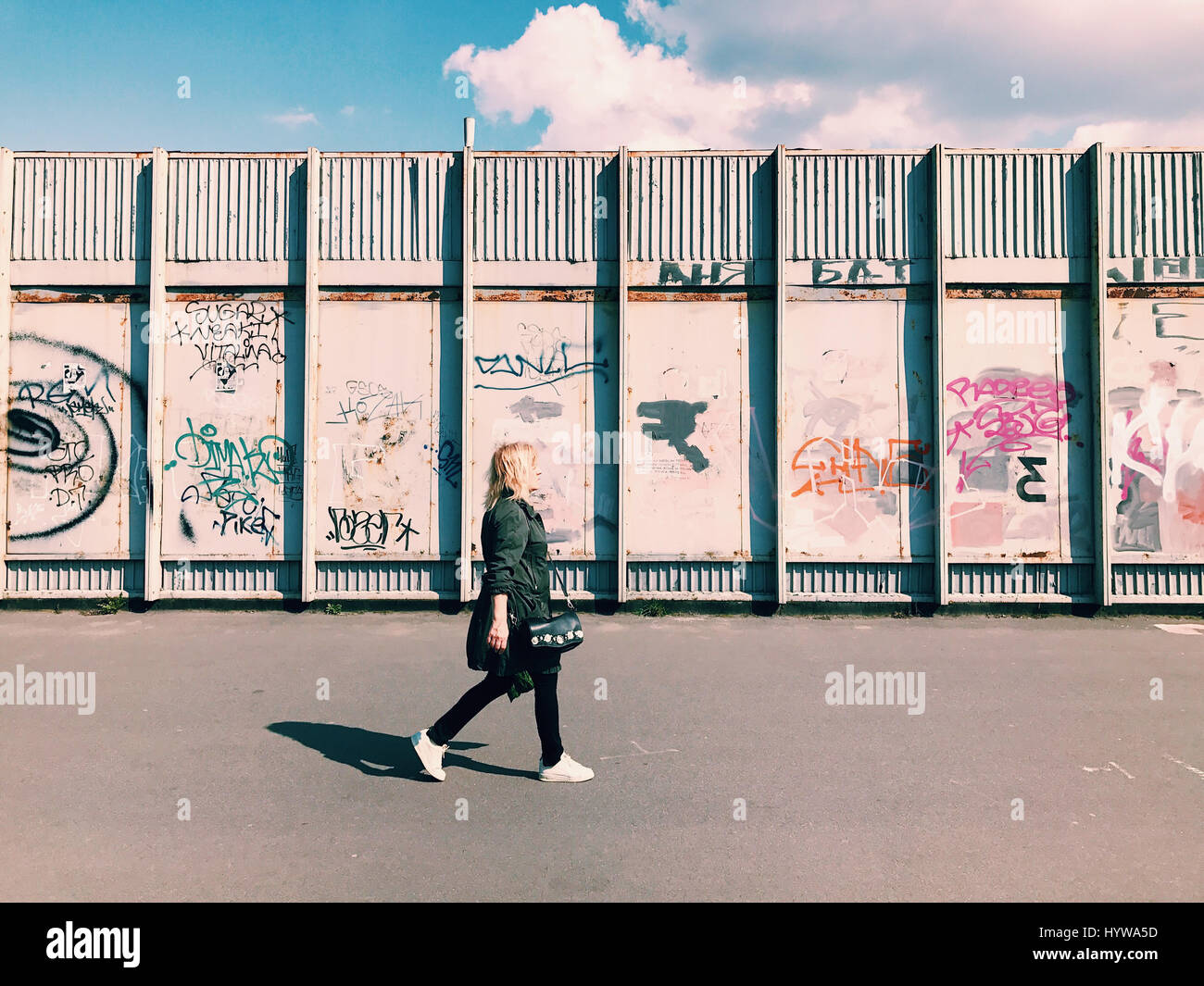 Kiev, Ukraine - April 04, 2017: Pedestrian goes Graffiti wall ...