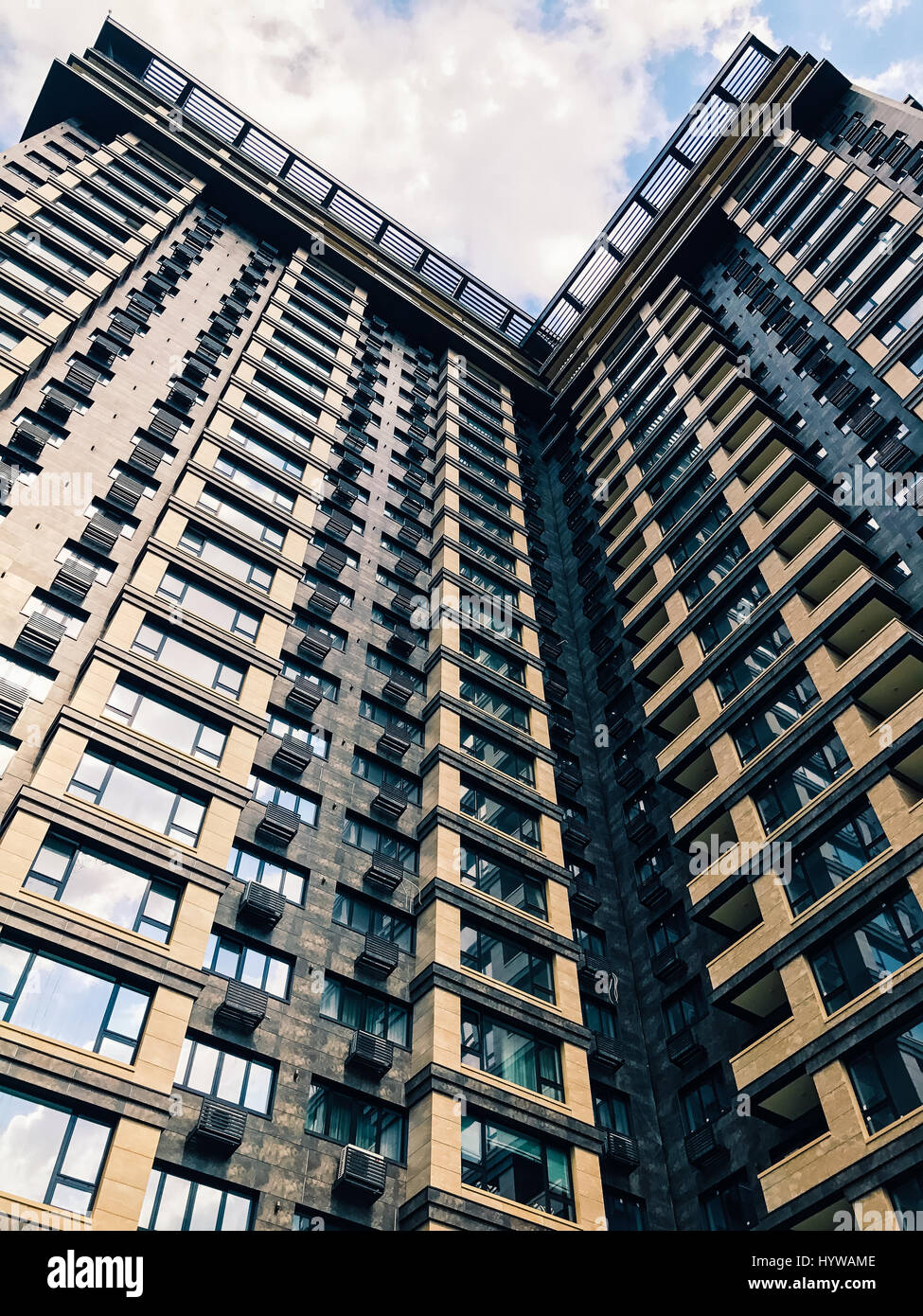 Top part of high-rise business building on blue sky Stock Photo - Alamy