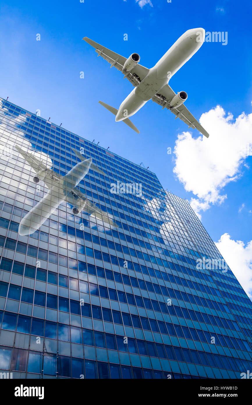 aeroplane flying over the skyscrapers. architecture building with ...