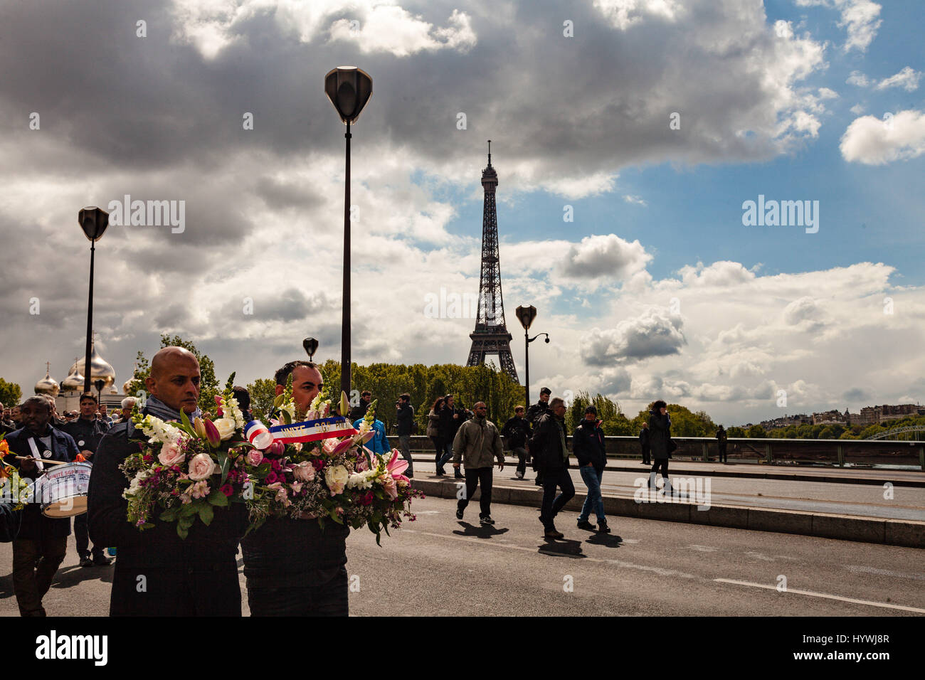 Paris, France. 26th April, 2017. Police officers hold funeral flowers ...