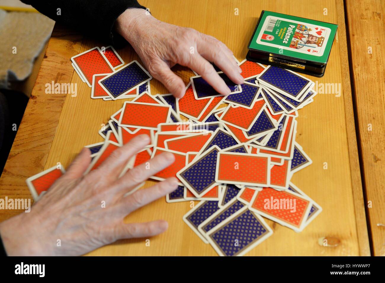 Woman playing solitaire card game hi-res stock photography and images ...