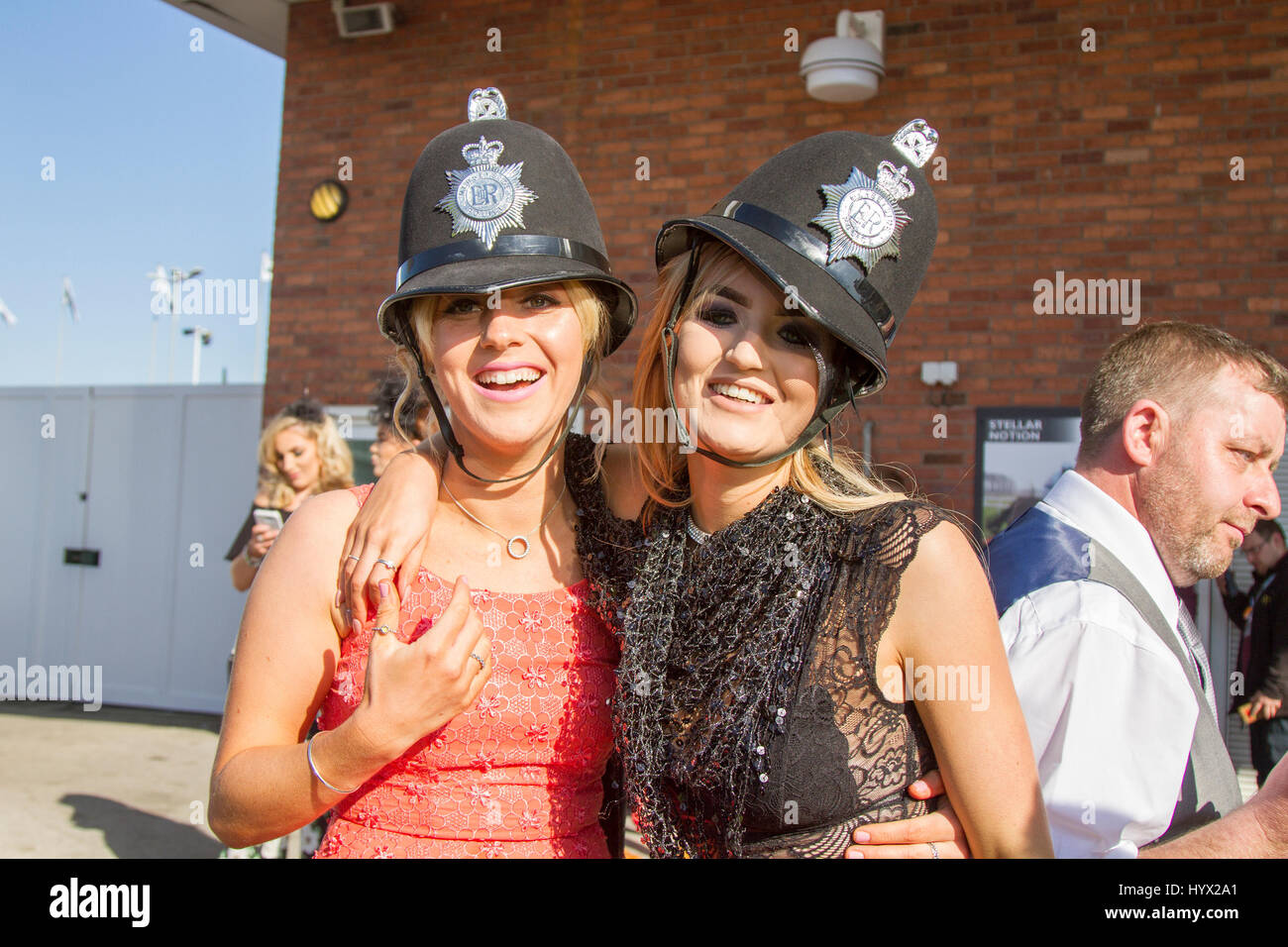 Racegoers fwearing Police Helmets, female fashions, high-fashion ...