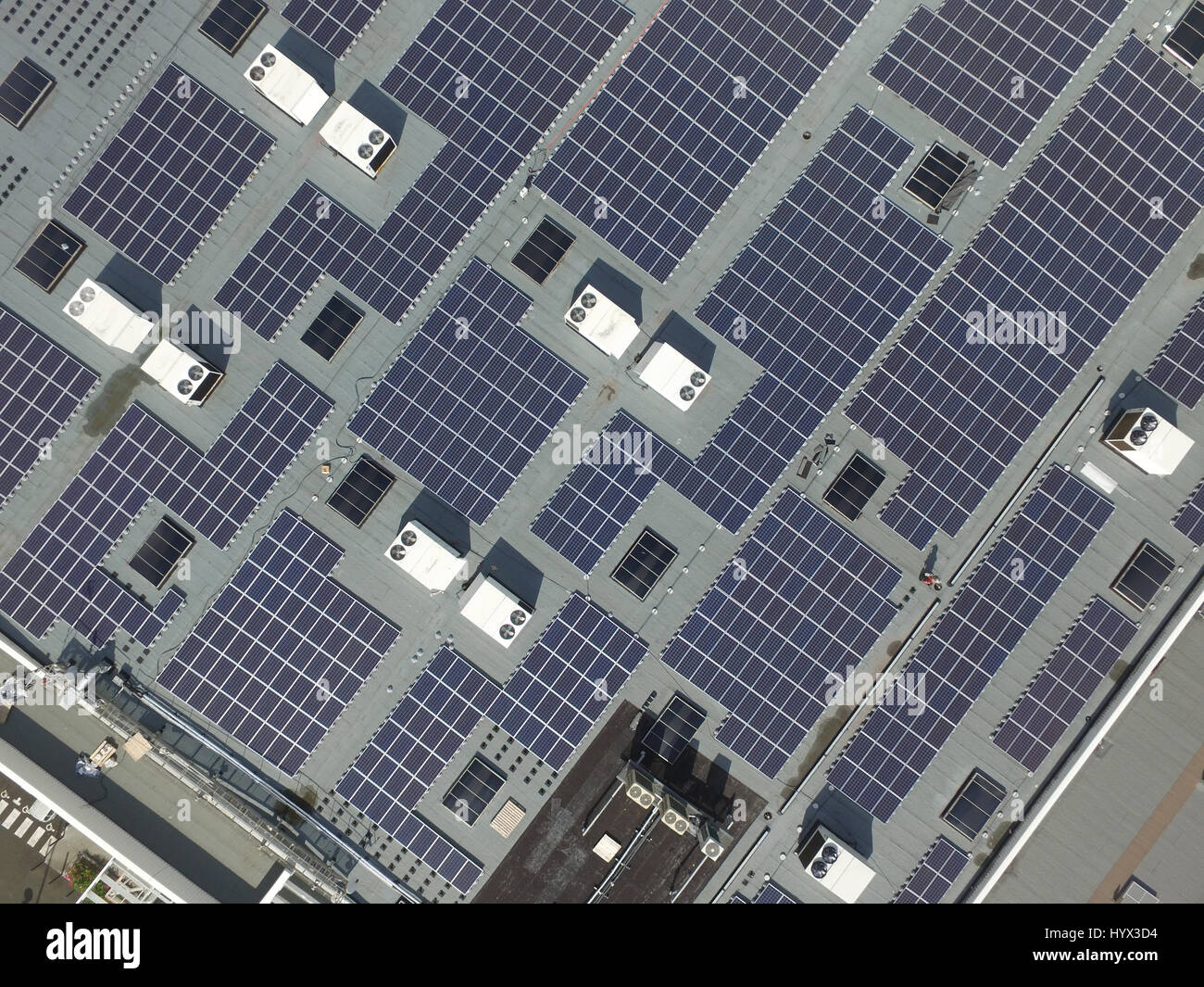 Solar panels on a flat roof Stock Photo - Alamy